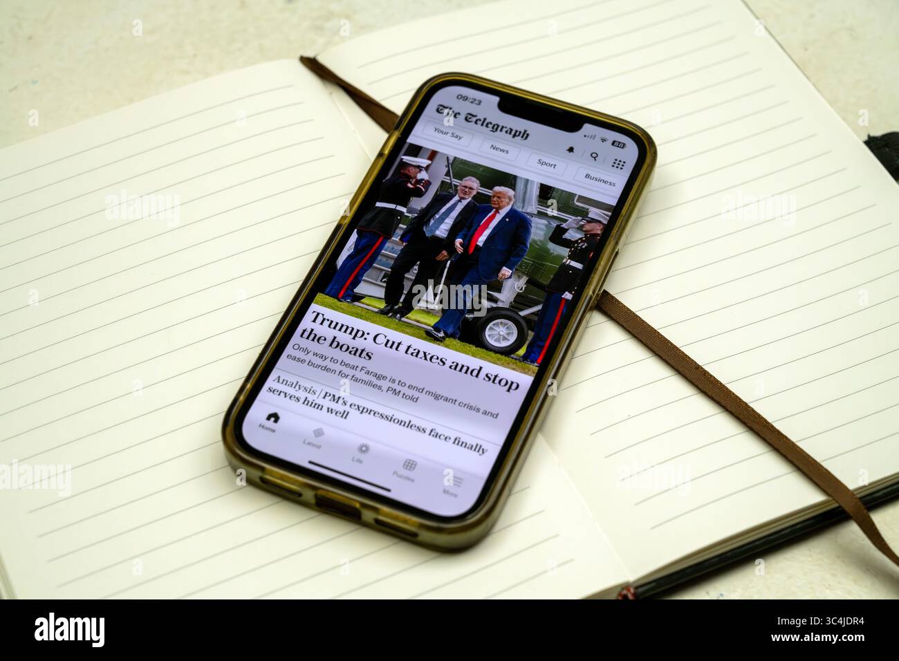 Smartphone screen showing Donald Trump and Keir Starmer on The ...