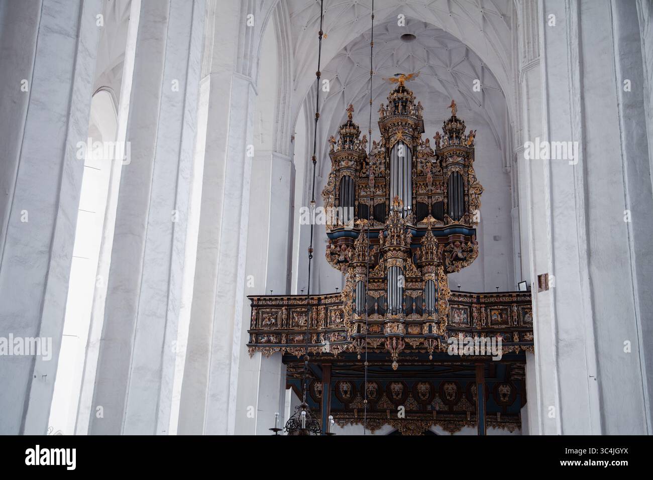 Gdansk, Poland - 04-07-2025 - Majestic antique pipe organ decorated ...