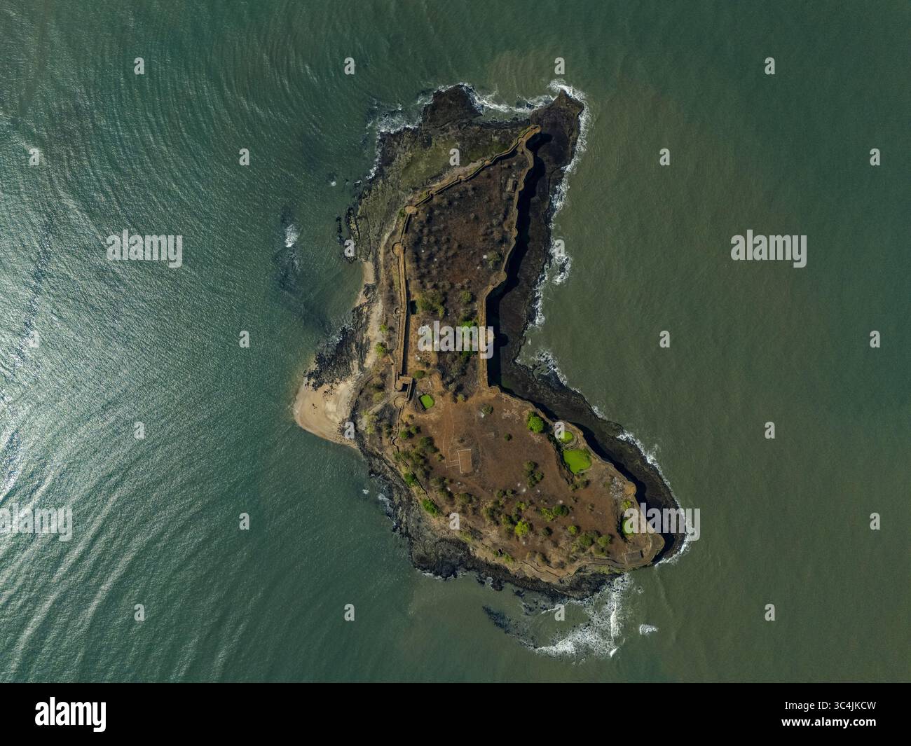 Aerial view of Suvarnadurg Fort surrounded by the deep blue sea, Dapoli ...