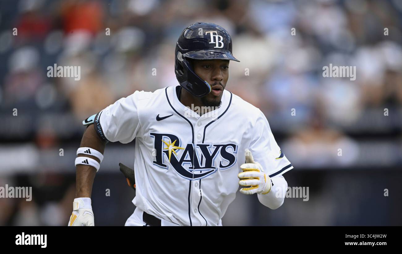 Tampa Bay Rays' Chandler Simpson runs after hitting a pitch during the ...
