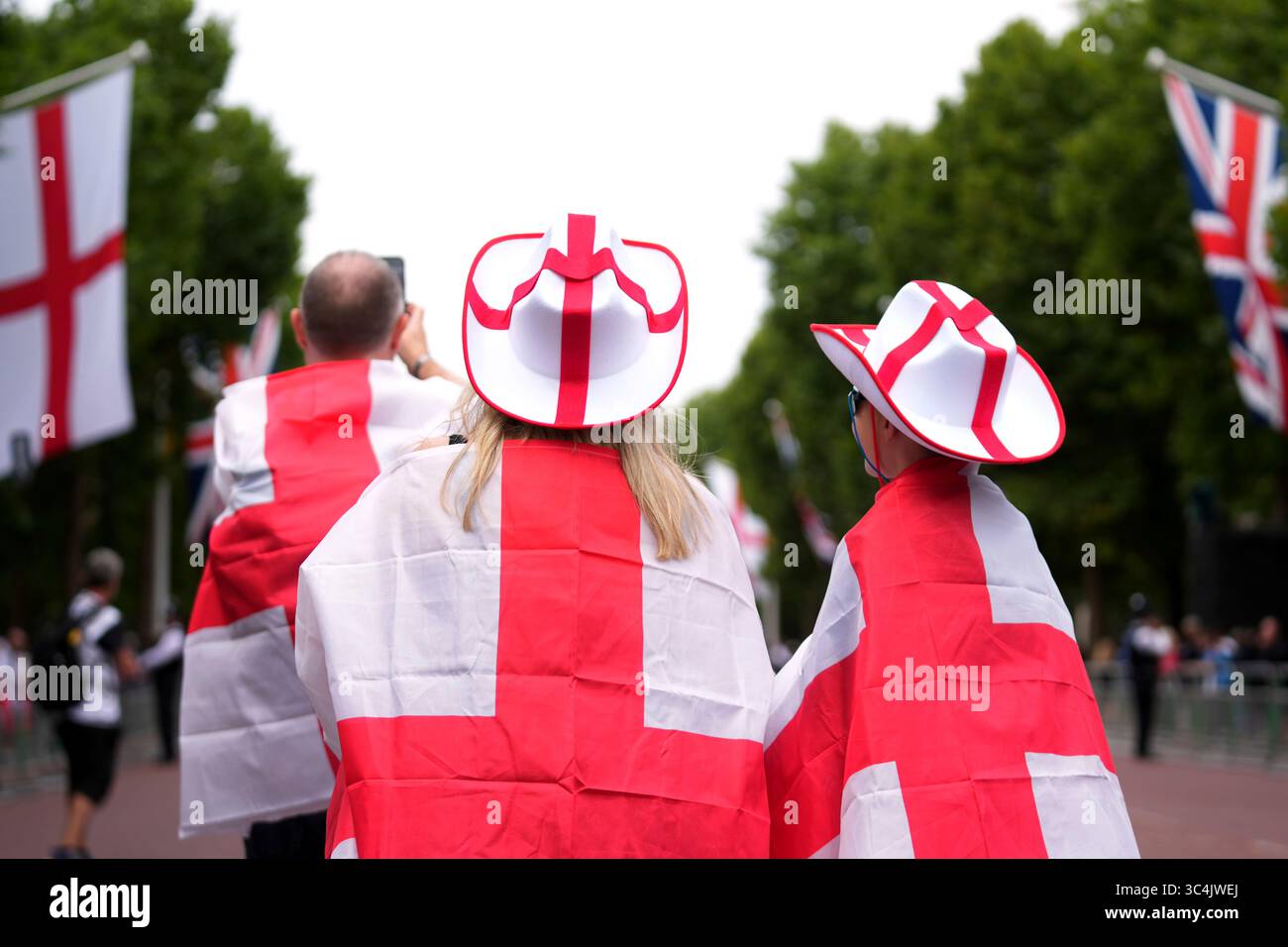 England soccer fans arrive to celebrate during an open-top bus ...