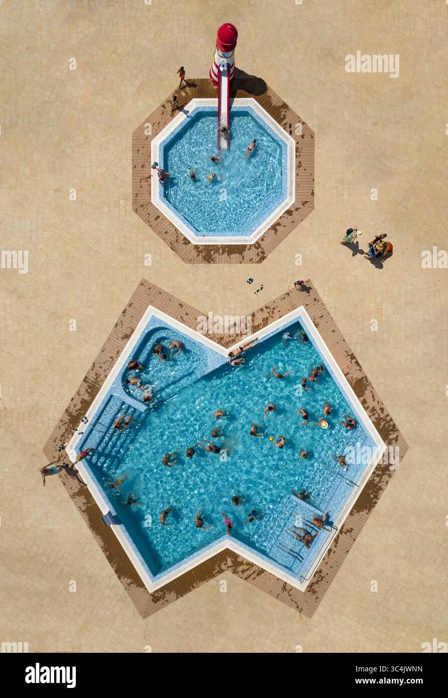 Aerial view of shimmering turquoise pools teeming with life amid sun ...