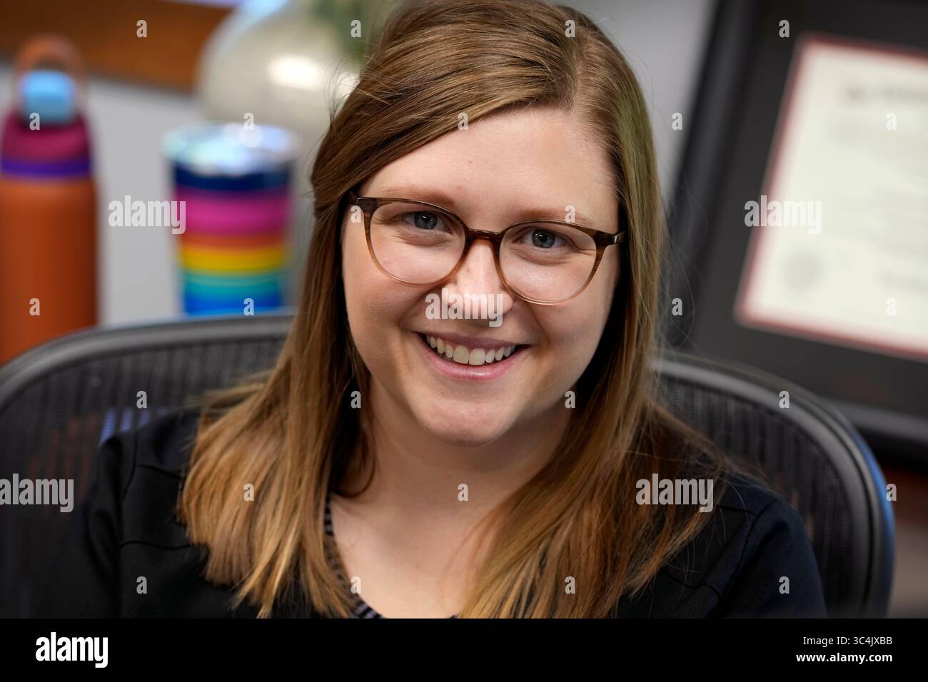 Audiologist Courtney Thayer sits at her desk in her office, Monday ...
