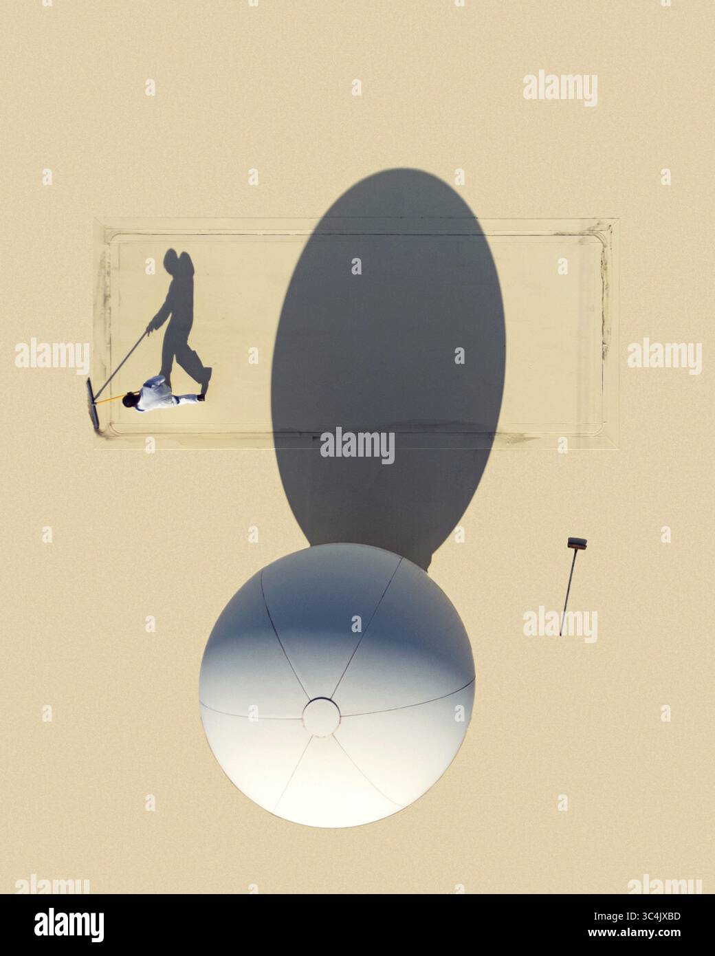 Aerial view of a surreal scene with a dark silhouette figure standing ...