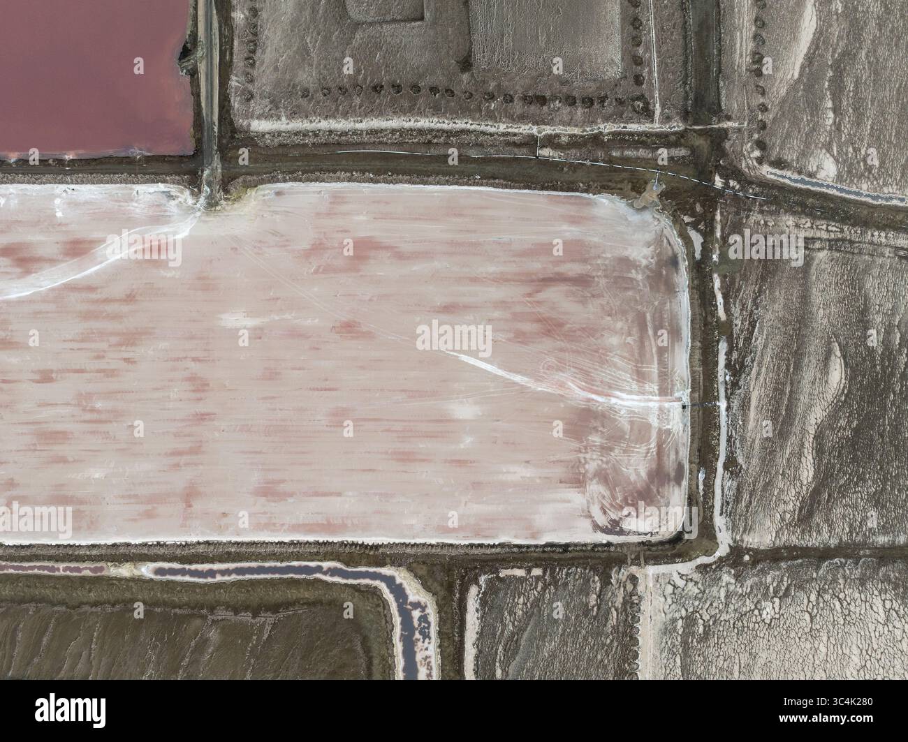 Aerial view of geometric salt ponds displaying a spectrum of pastel ...