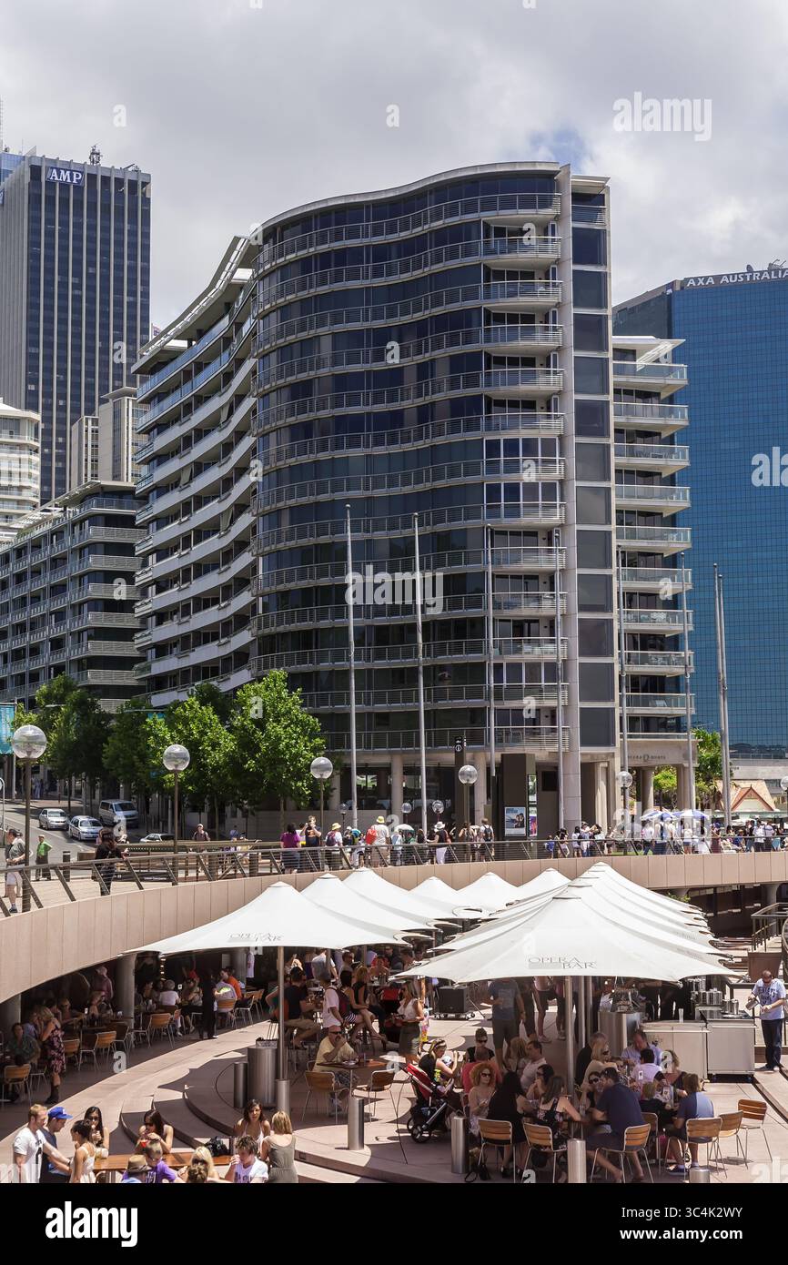 Tourists and locals relax at the Opera Bar along The Forecourt, Sydney ...