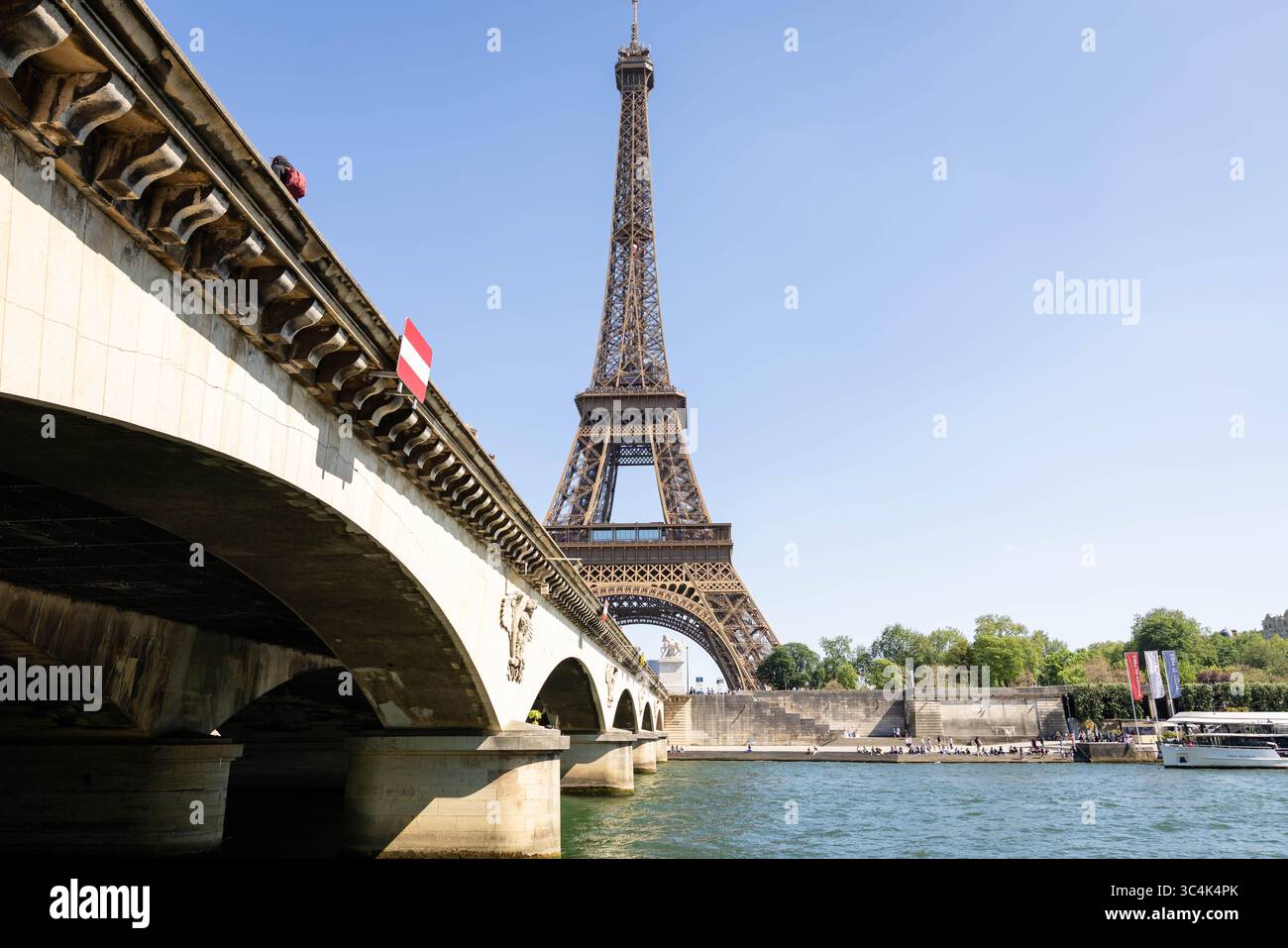 Eiffel Tower and Pont d'Iéna bridge from Seine riverside perspective ...