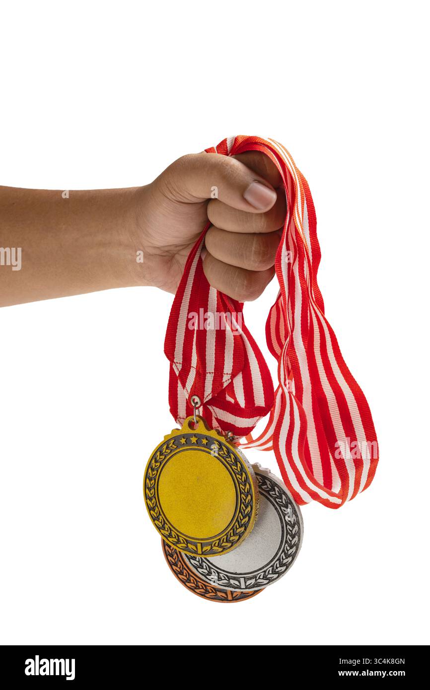 Human hand holding set of bronze, silver and golden award medals ...