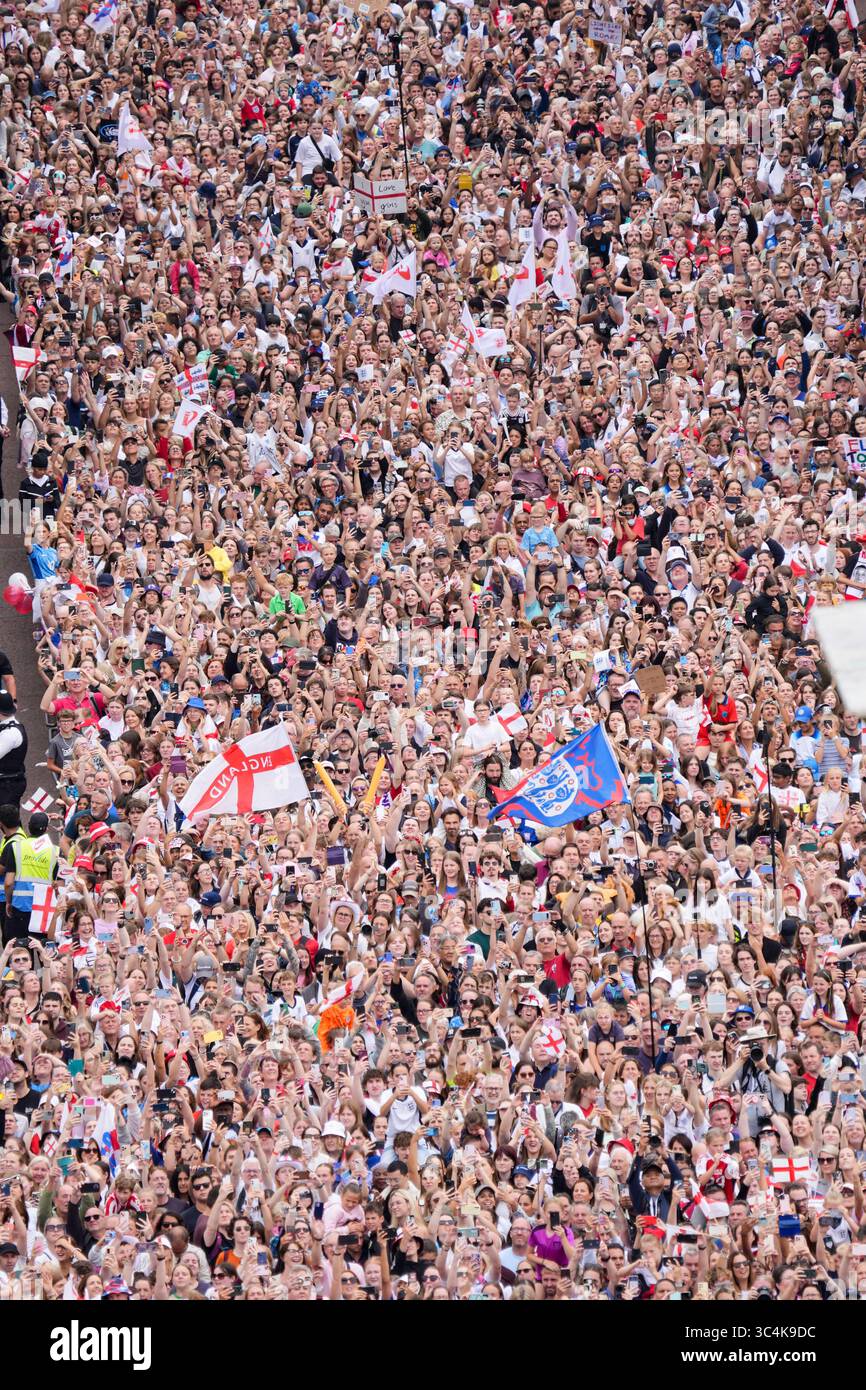 England fans gather on the steps of the Victoria Memorial during a ...