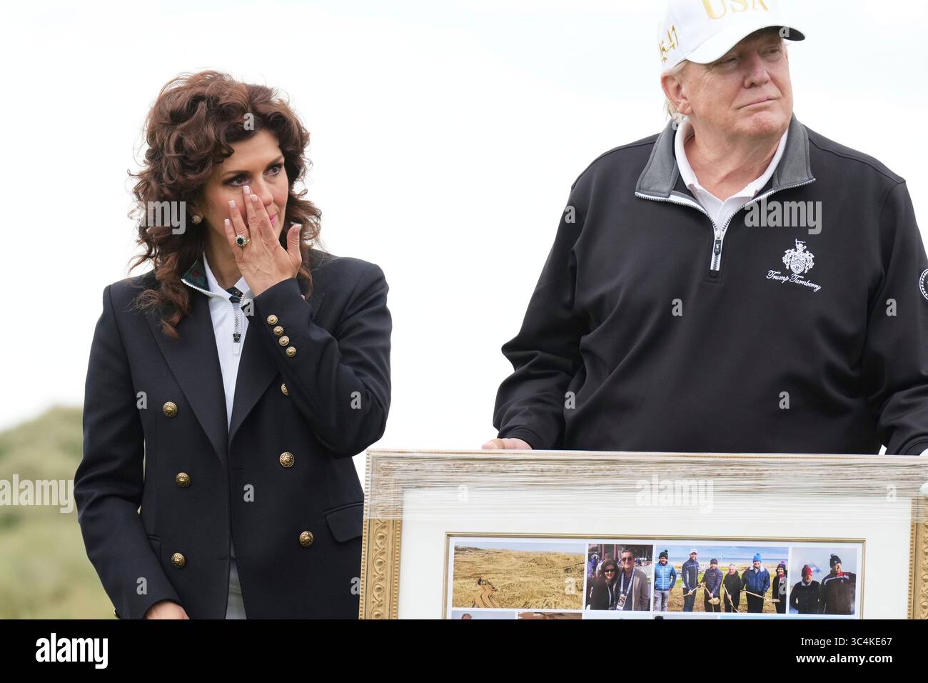 Sarah Malone reacts after President Donald Trump presented her with a ...