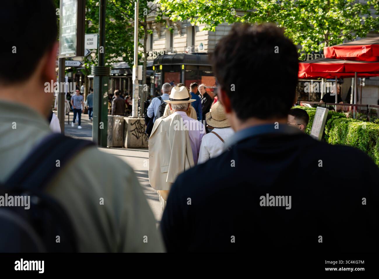 Man walks past outdoor seating hi-res stock photography and images - Alamy