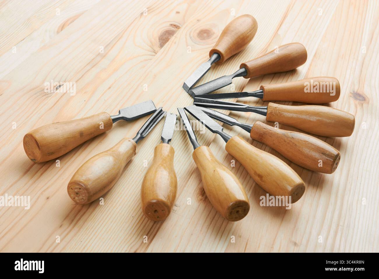Set of Chisels on wooden background Stock Photo - Alamy