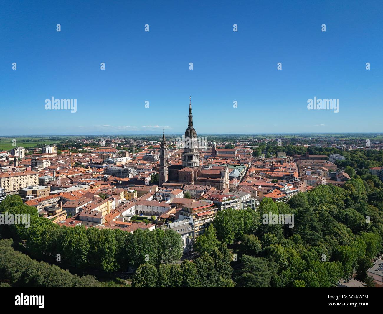 Aerial view of terracotta rooftops contrasting with the lush green ...