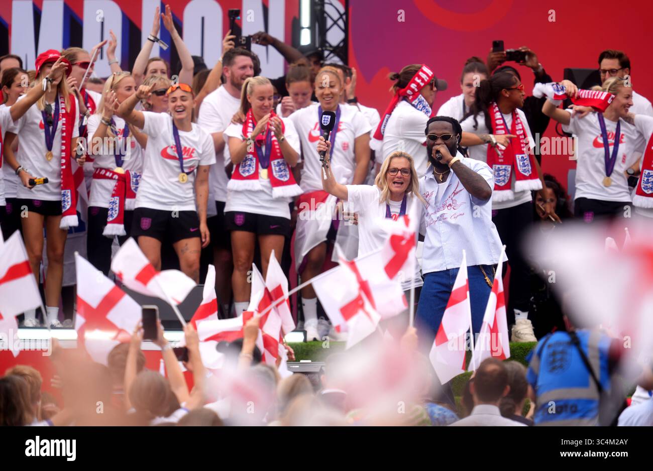 Burna Boy performs as England manager Sarina Wiegman and players ...