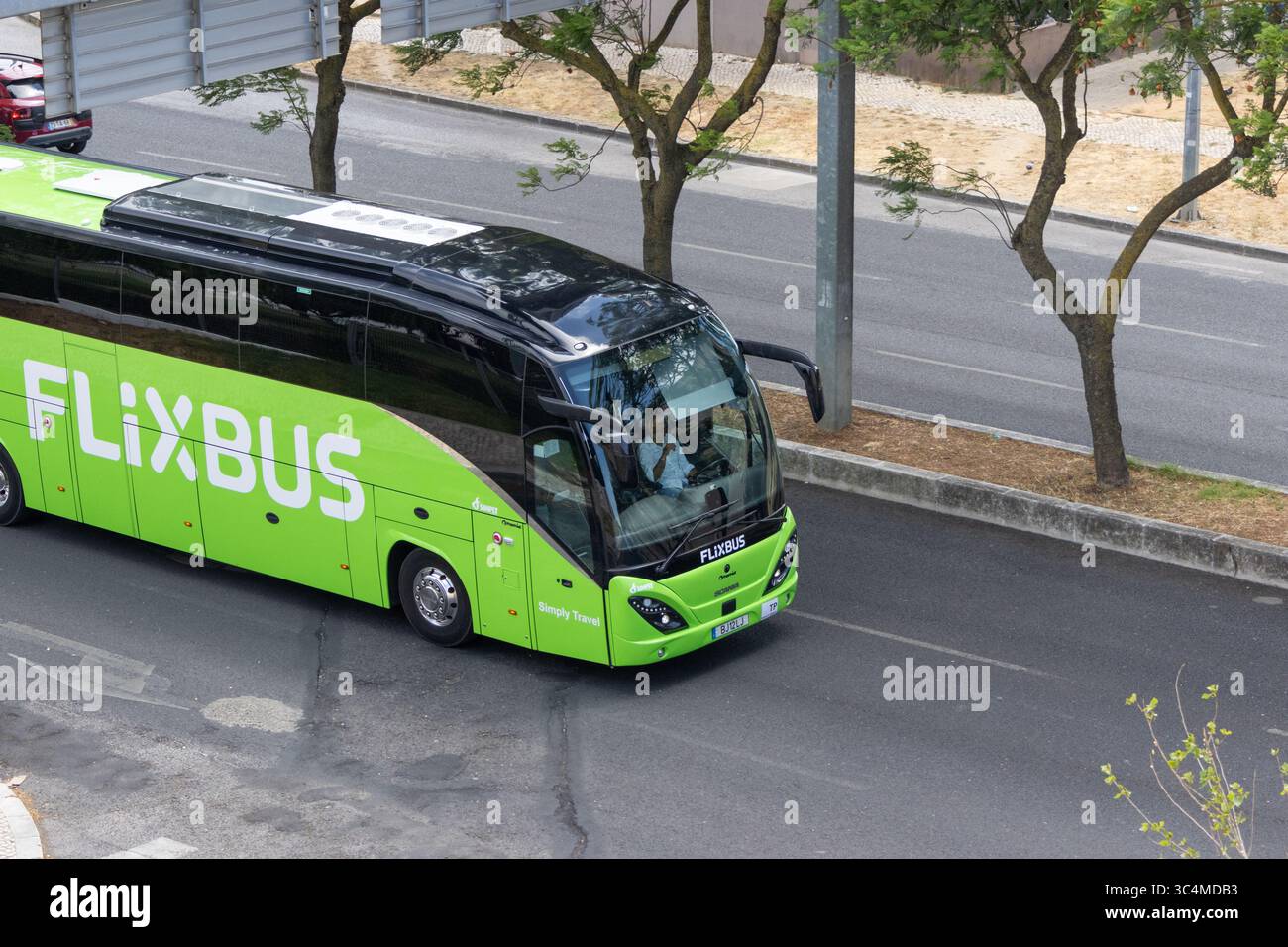 Aerial view of a green flixbus driving through lisbon Stock Photo - Alamy