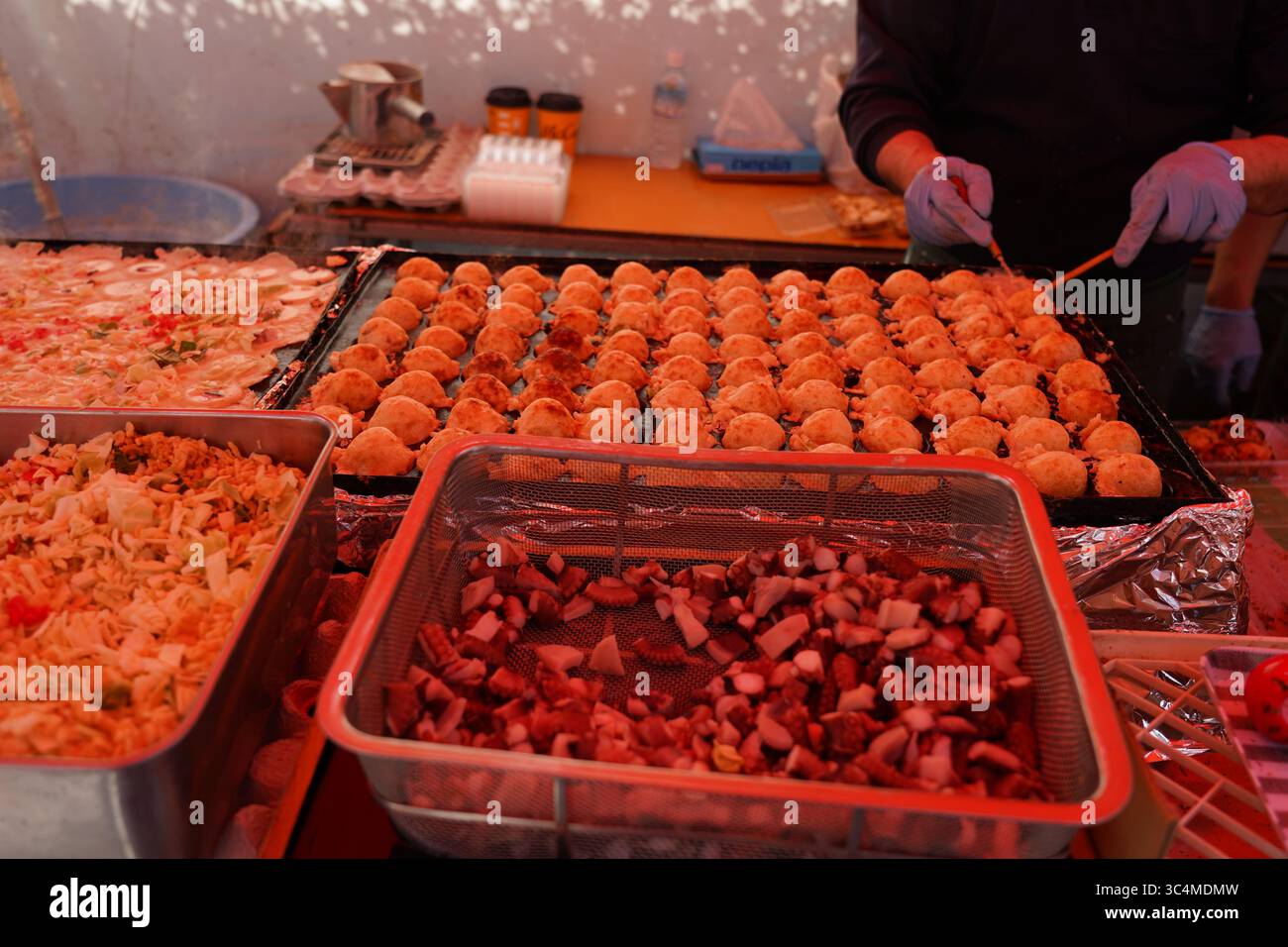 The making of Takyoyaki in a food stall near the Fushimi Inari Temple ...