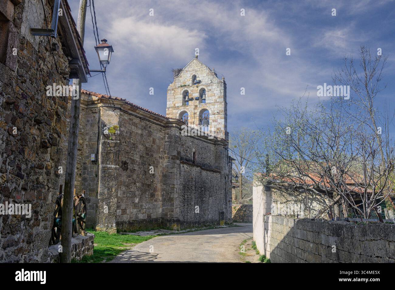 Old Romanesque-style church with stone walls, tiled roof, and bell ...