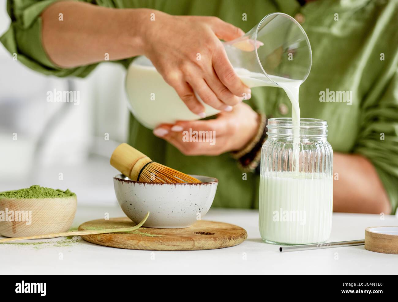 Woman pours green iced tea hi-res stock photography and images - Alamy