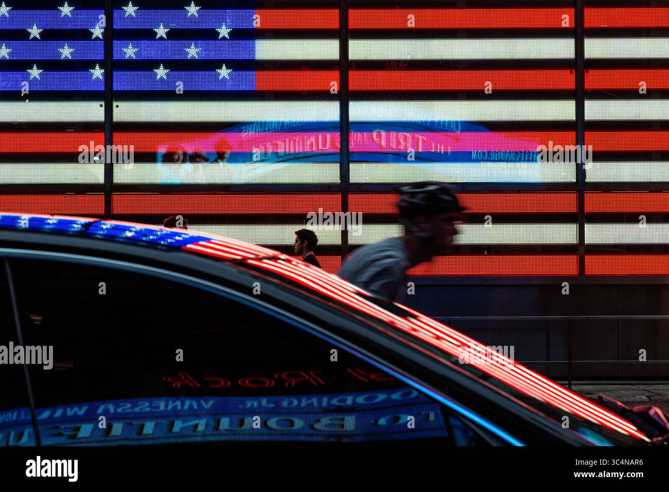The bright red and white stripes of the American flag are reflected on ...