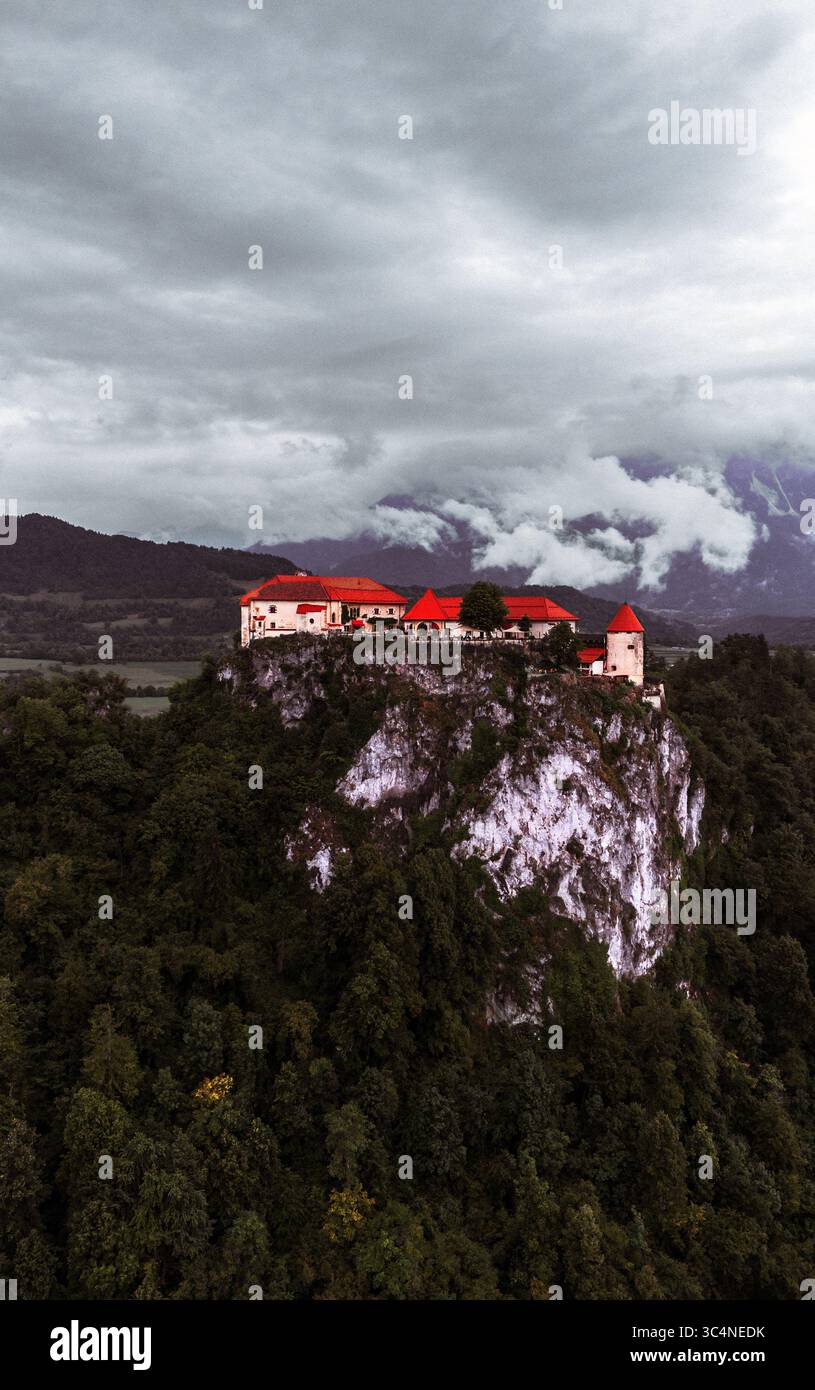 Aerial view of Bled Castle standing proudly atop a rocky outcrop amidst ...