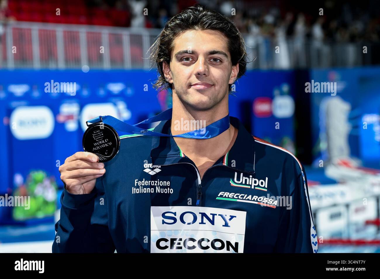 Thomas Ceccon of Italy shows the silver medal after competing in the ...