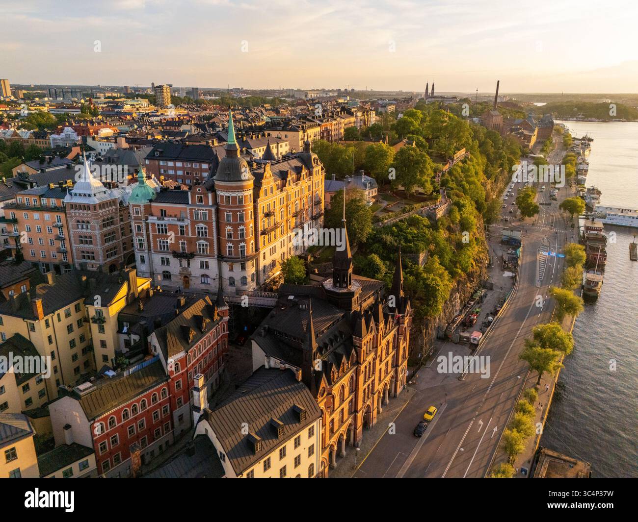 Aerial view of historic buildings and lush greenery line the waterways ...