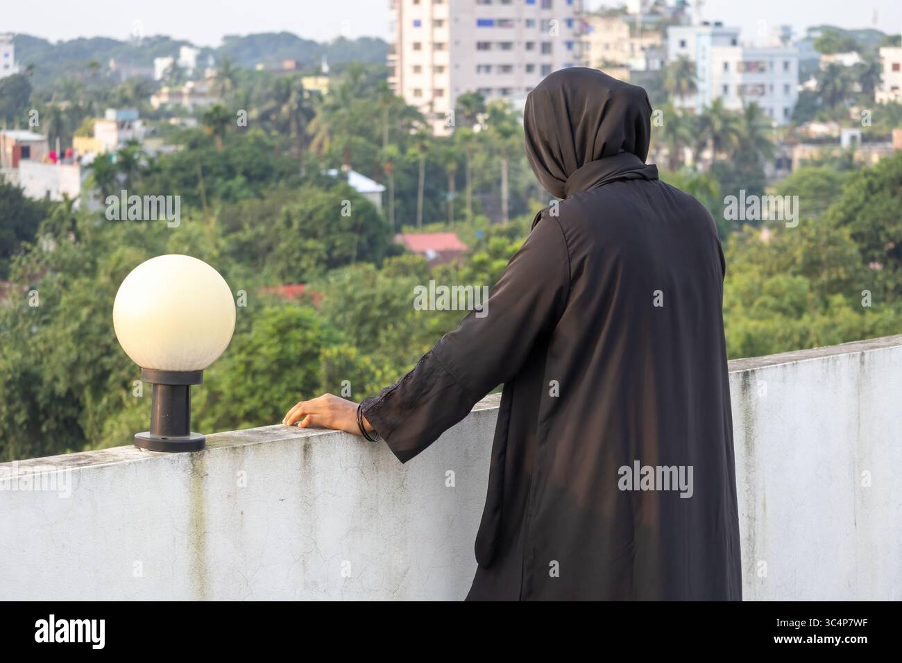 Calm modest woman in black hi-res stock photography and images - Alamy