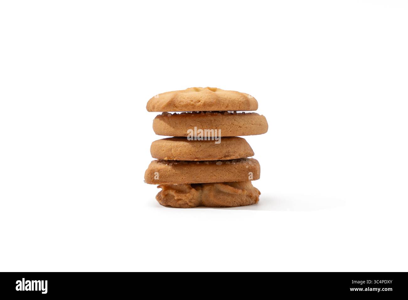 A vertical stack of four Danish butter cookies of different shapes ...