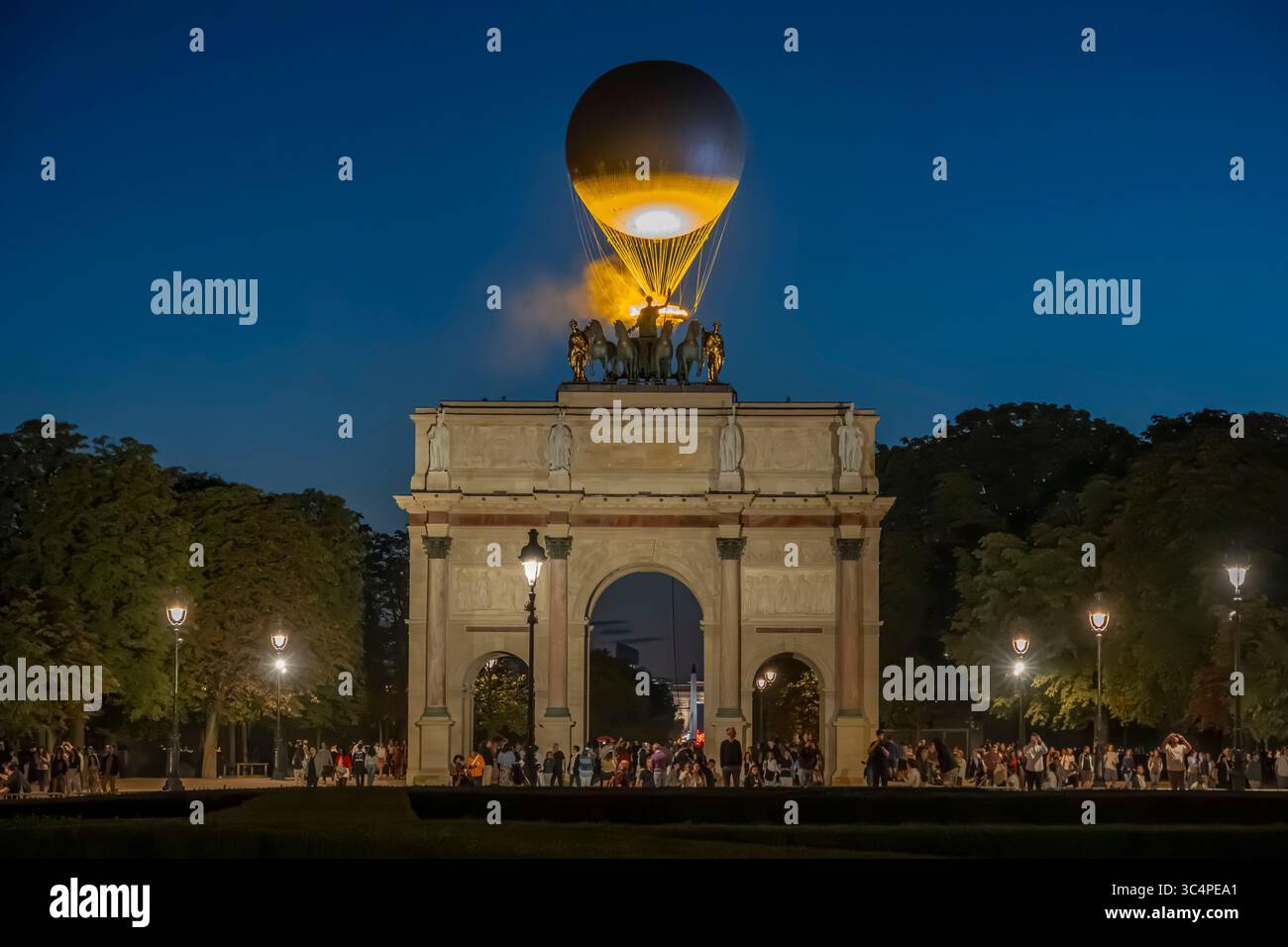 Paris, France - 07 28 2025: People standing are walking under Carrousel ...