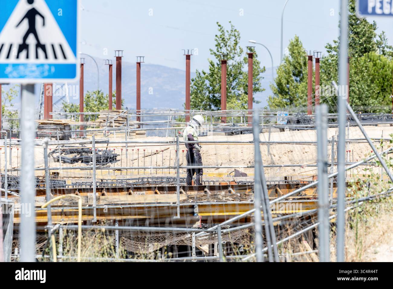 A worker works on the construction of a new home on July 29, 2025, in ...
