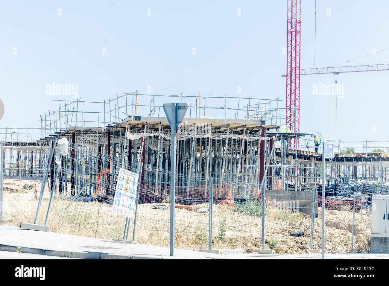 Workers work on the construction of a new home on July 29, 2025, in ...