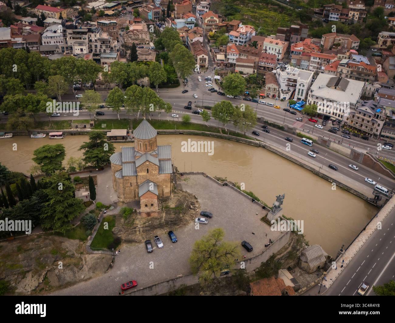 Aerial view of Metekhi Church standing prominently on a cliff ...