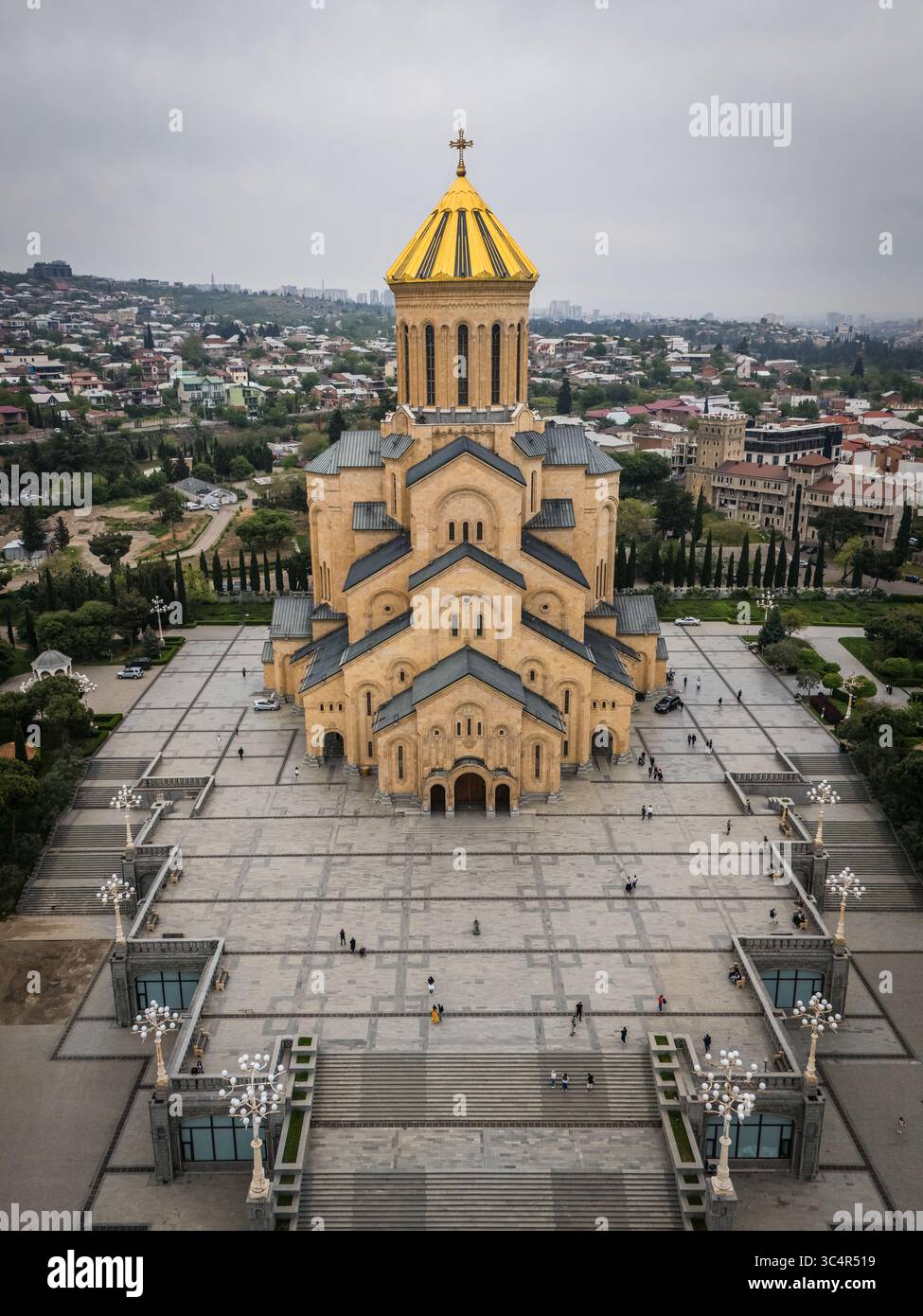 Aerial view of Sameba Cathedral's golden dome gleaming against the ...