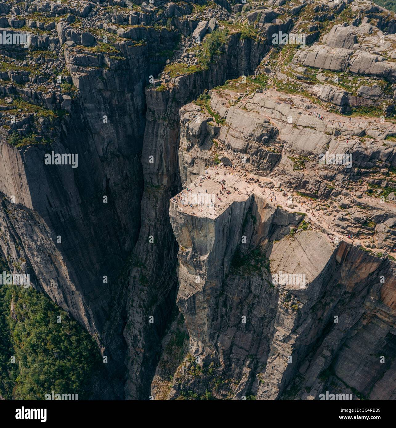 Aerial view of the iconic Preikestolen plateau, a dramatic cliff rising ...