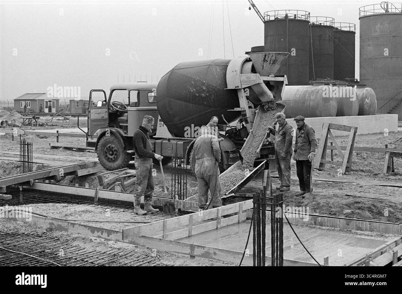 Pouring cement from cement mixer Black and White Stock Photos & Images ...