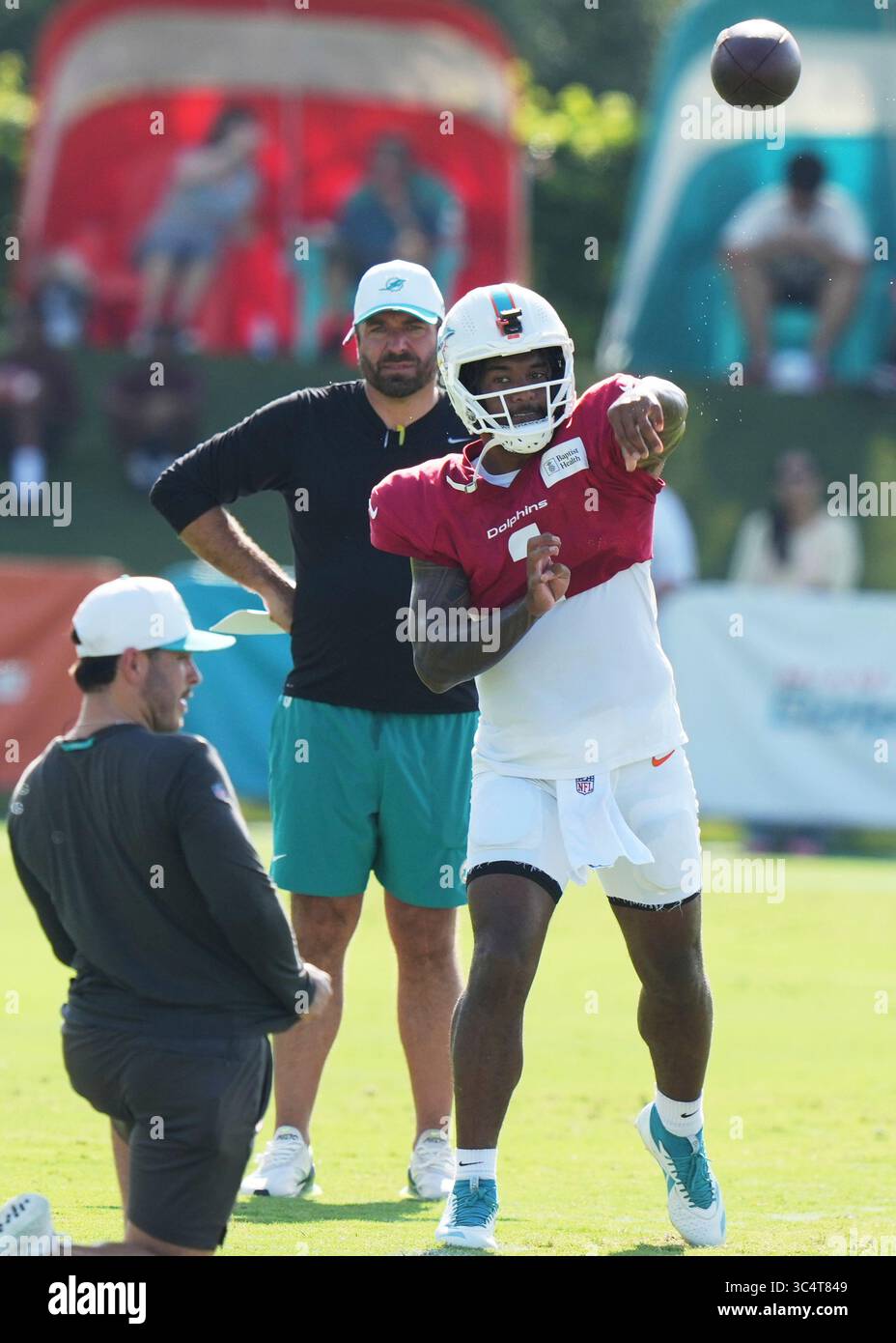 Miami Dolphins quarterback Tua Tagovailoa throws during practice at the NFL football team's ...