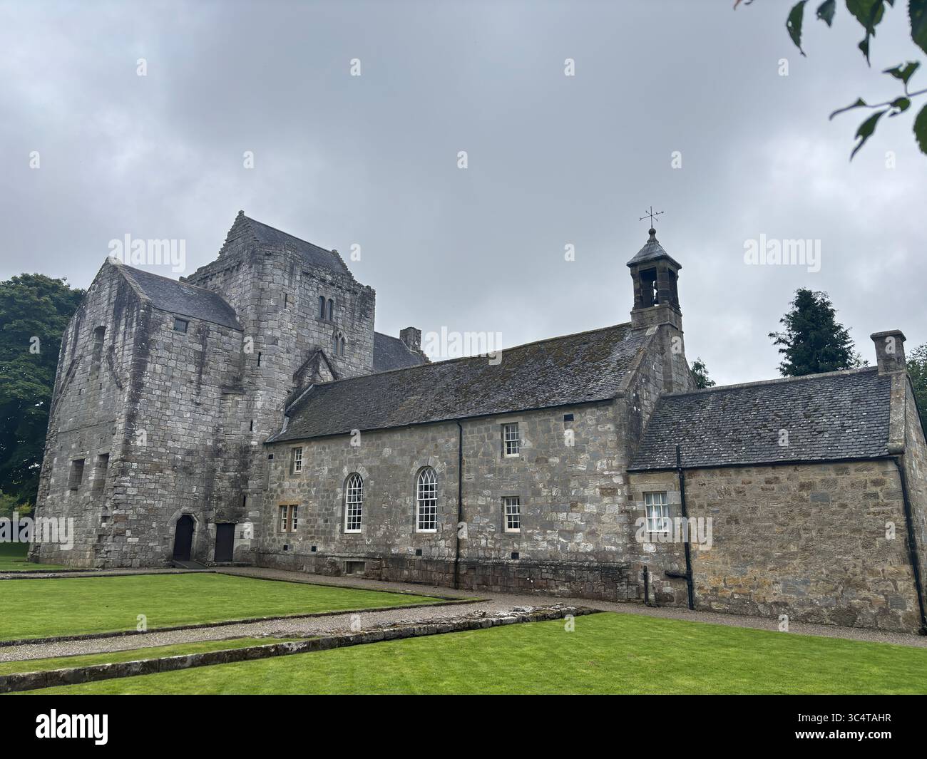 Ruined medieval Preceptory tower and transepts in Torphichen, showing ...