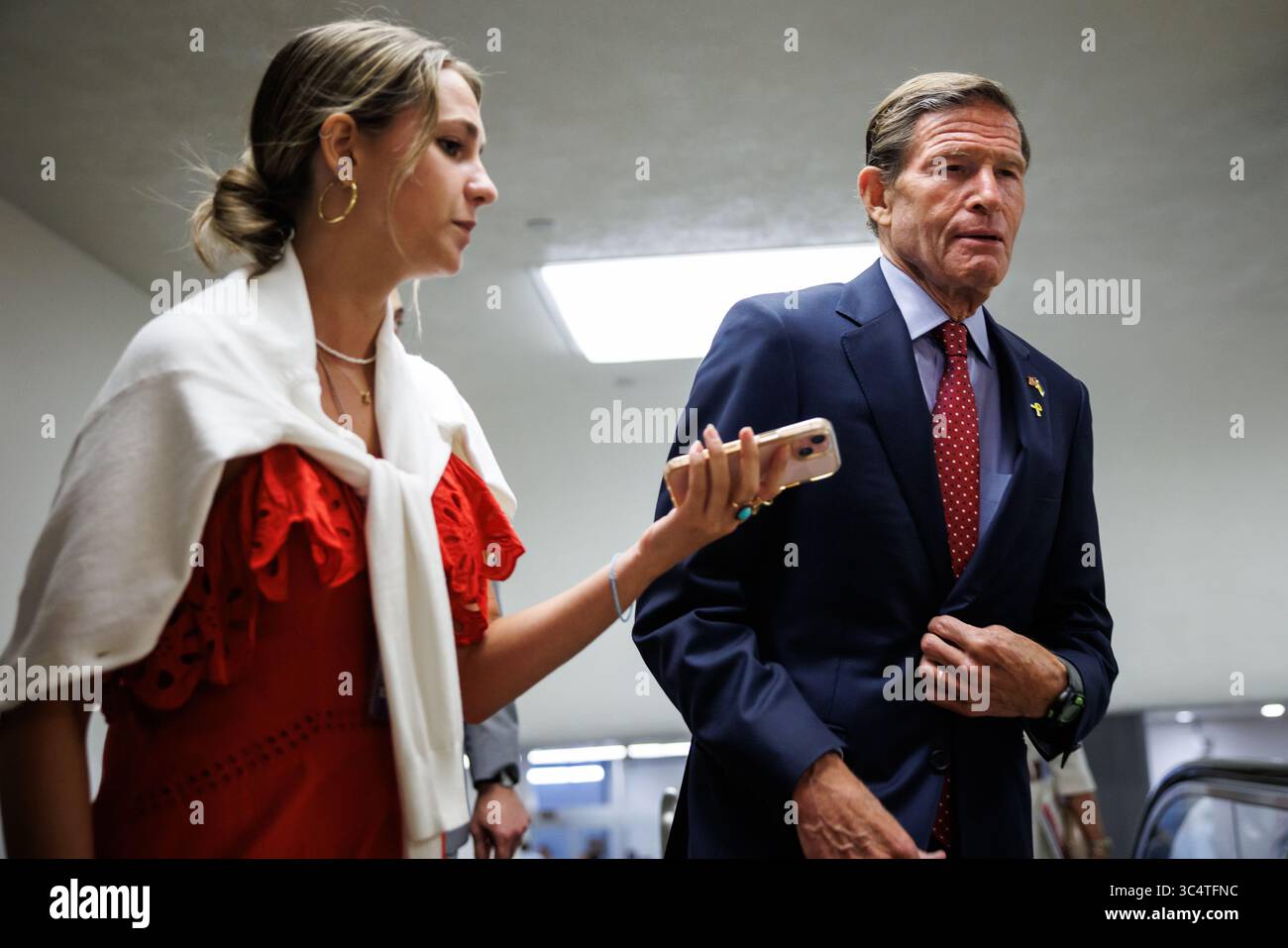 U.S. Sen. Richard Blumenthal (R-CT) talks to a reporter as he heads to ...