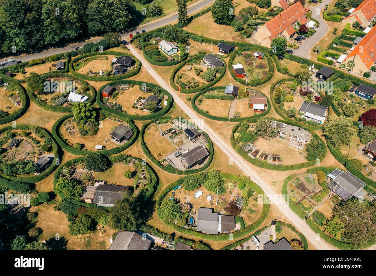 Aerial view of neatly arranged circular gardens housing charming ...