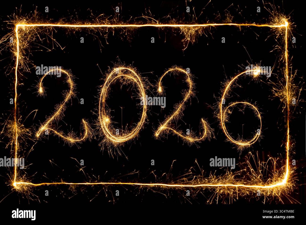 Happy New Year 2026. Number 2026 written sparkling sparklers on rectangular frame and black ...