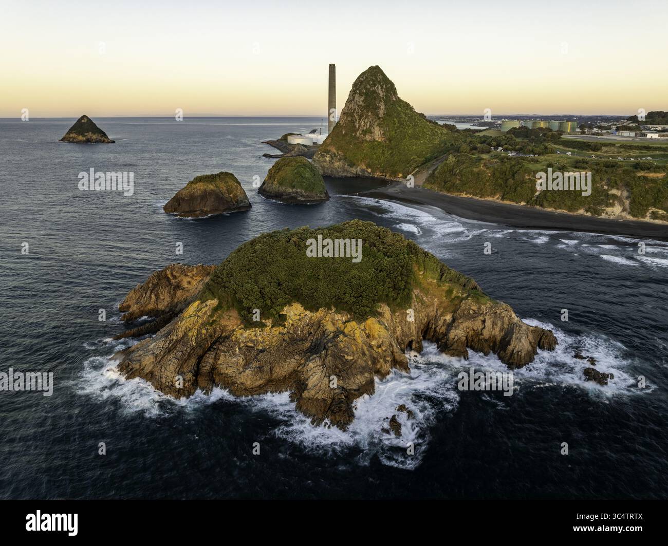 Aerial view of rugged, moss-covered islands surrounded by white-capped ...