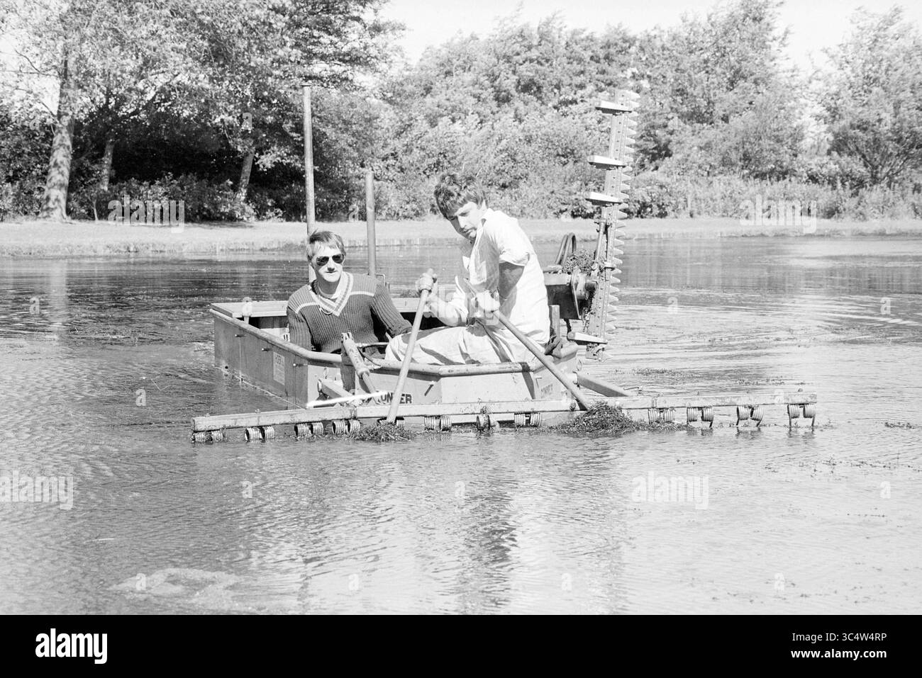 Pond cleaning Black and White Stock Photos & Images - Alamy