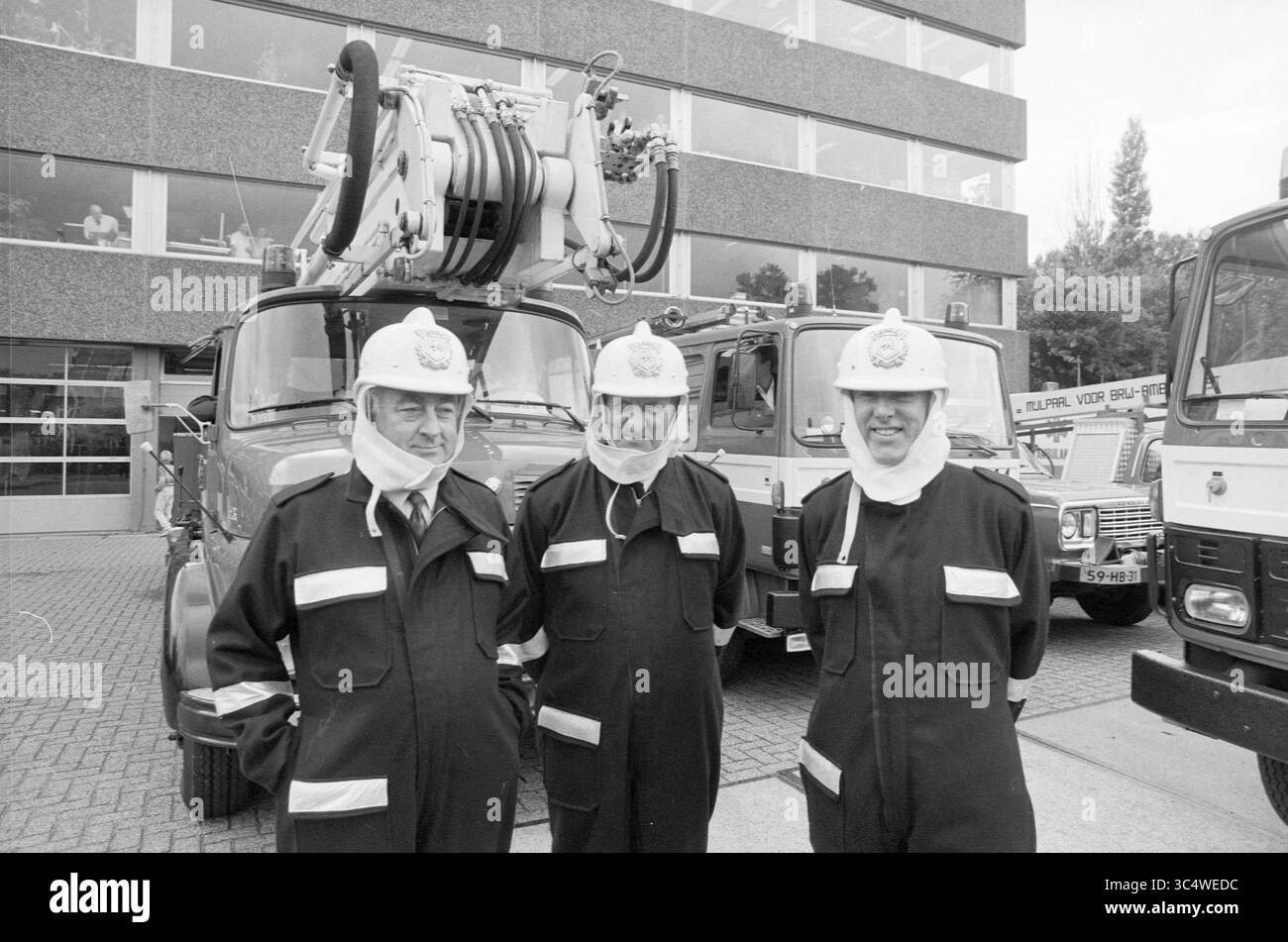 Mayor and two former mayors of Haarlemmermeer in firefighter clothing ...