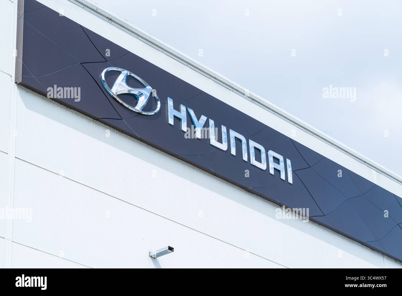 Norwich, UK – July 25th 2025: External signage on the side of a ...