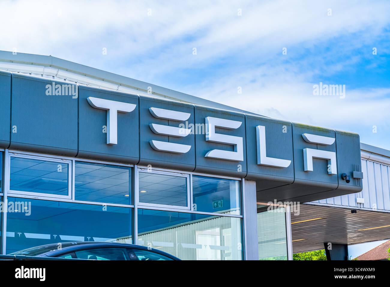 Norwich, UK – July 25th 2025: External signage on the side of a ...