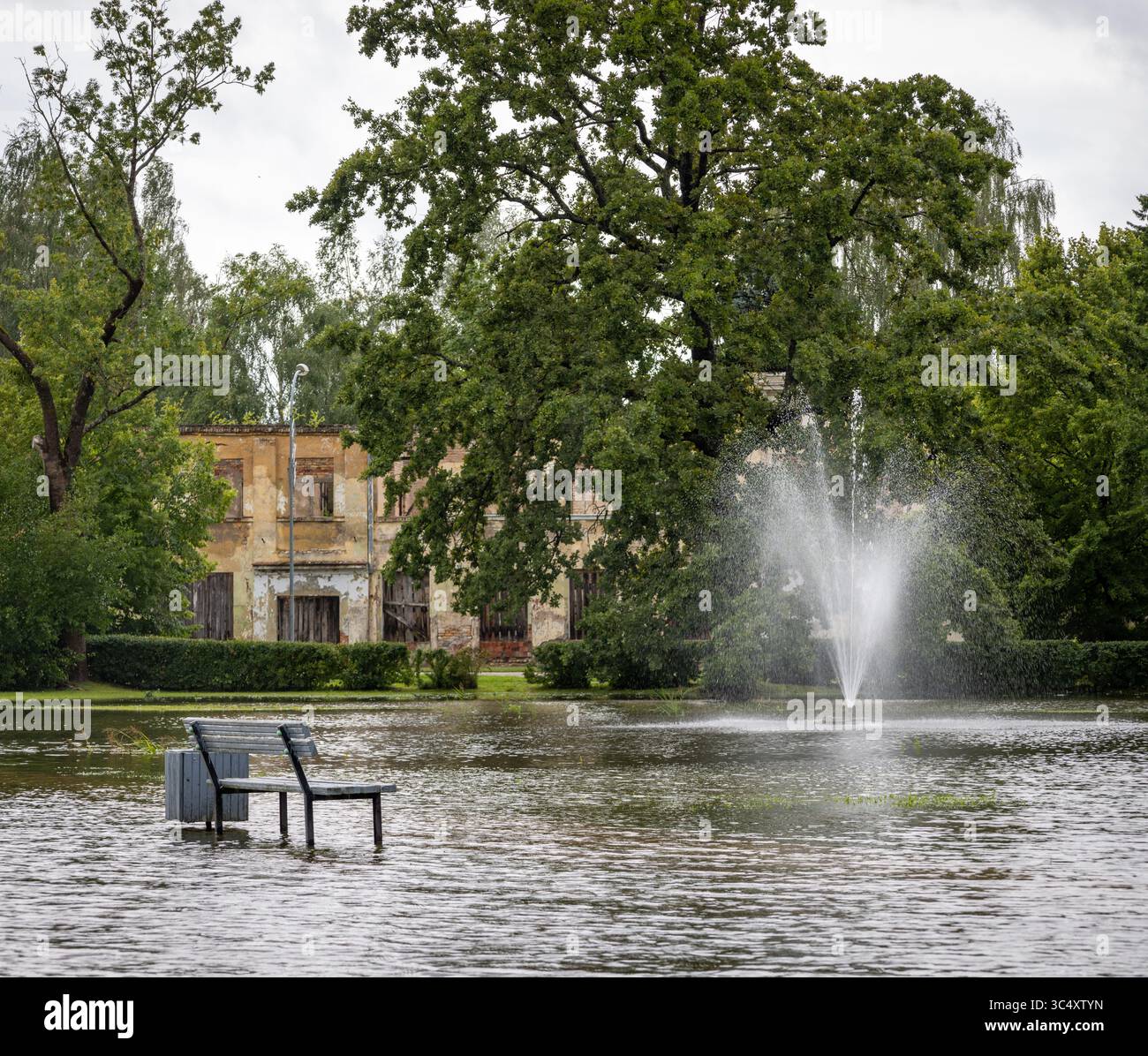 old park after storm, bench and fountain during floods Stock Photo - Alamy