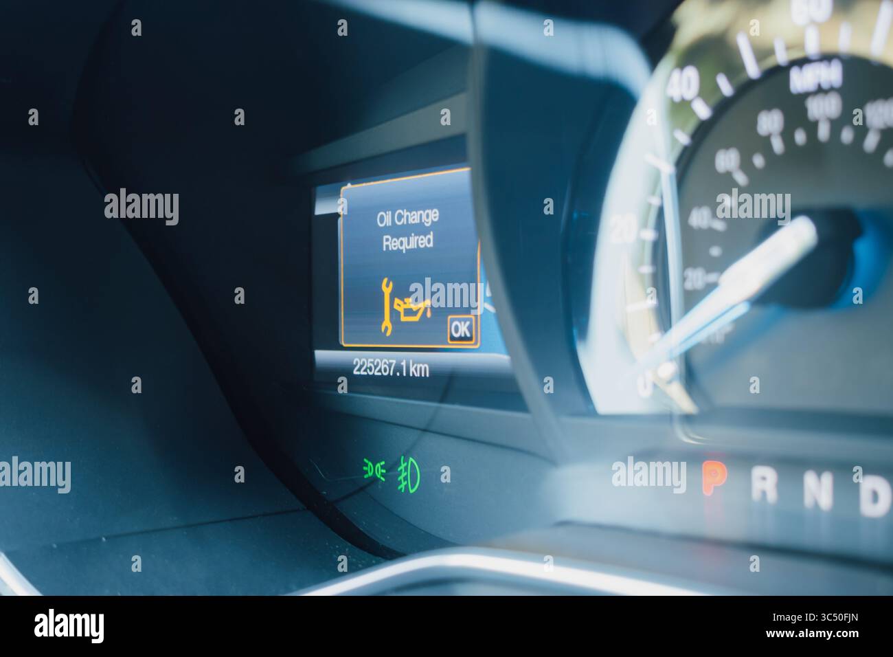 Oil change alert on a car dashboard display Stock Photo - Alamy