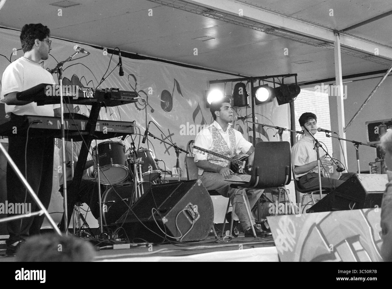 Two seated instrumentalists hi-res stock photography and images - Alamy