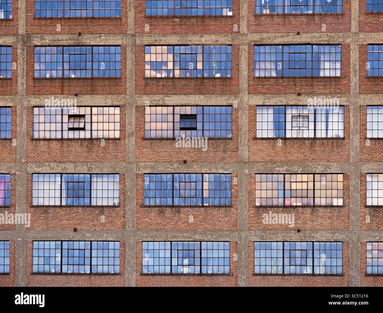 Reflections on multiple windowpanes of old warehouse Stock Photo - Alamy