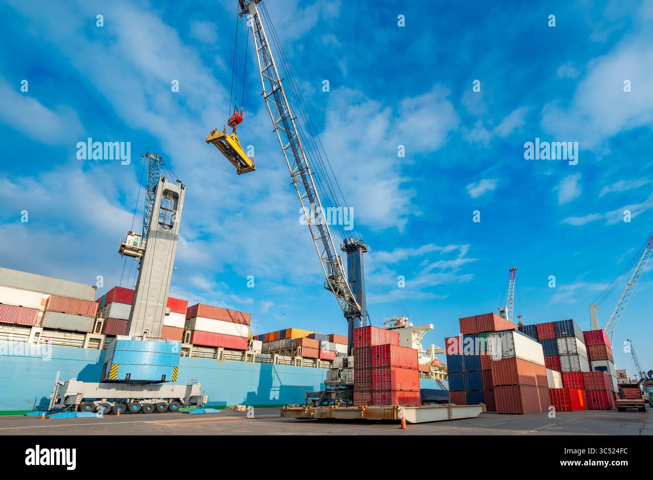Iquique, Chile: Container cranes load and unload cargo at the port, a ...